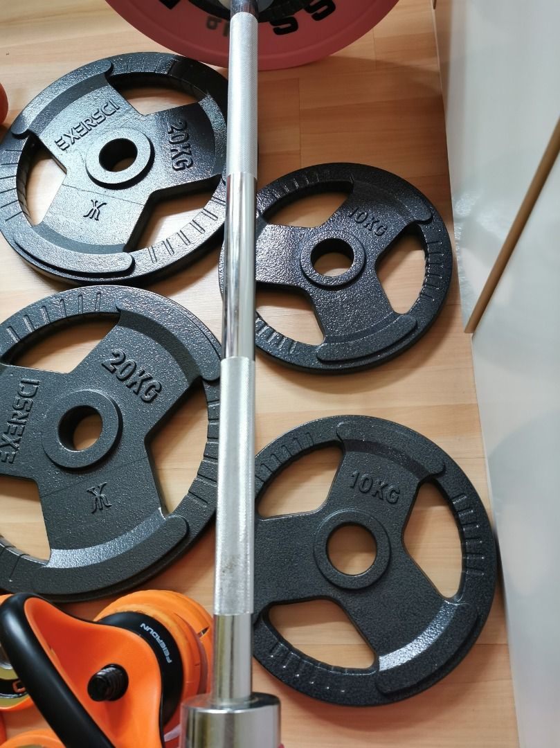 Home Gym Equipment - A Pink Weight Plates | Barbell | Dumbbells | An ...