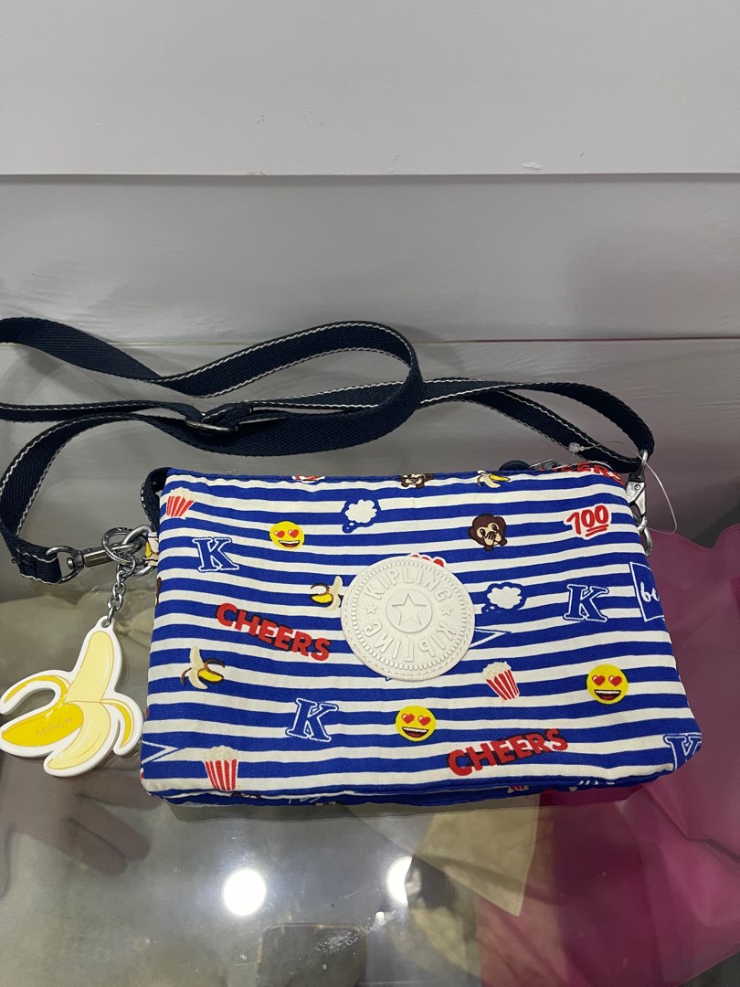 Kipling Emoji Sling bag, Women's Fashion, Bags & Wallets, Cross-body ...