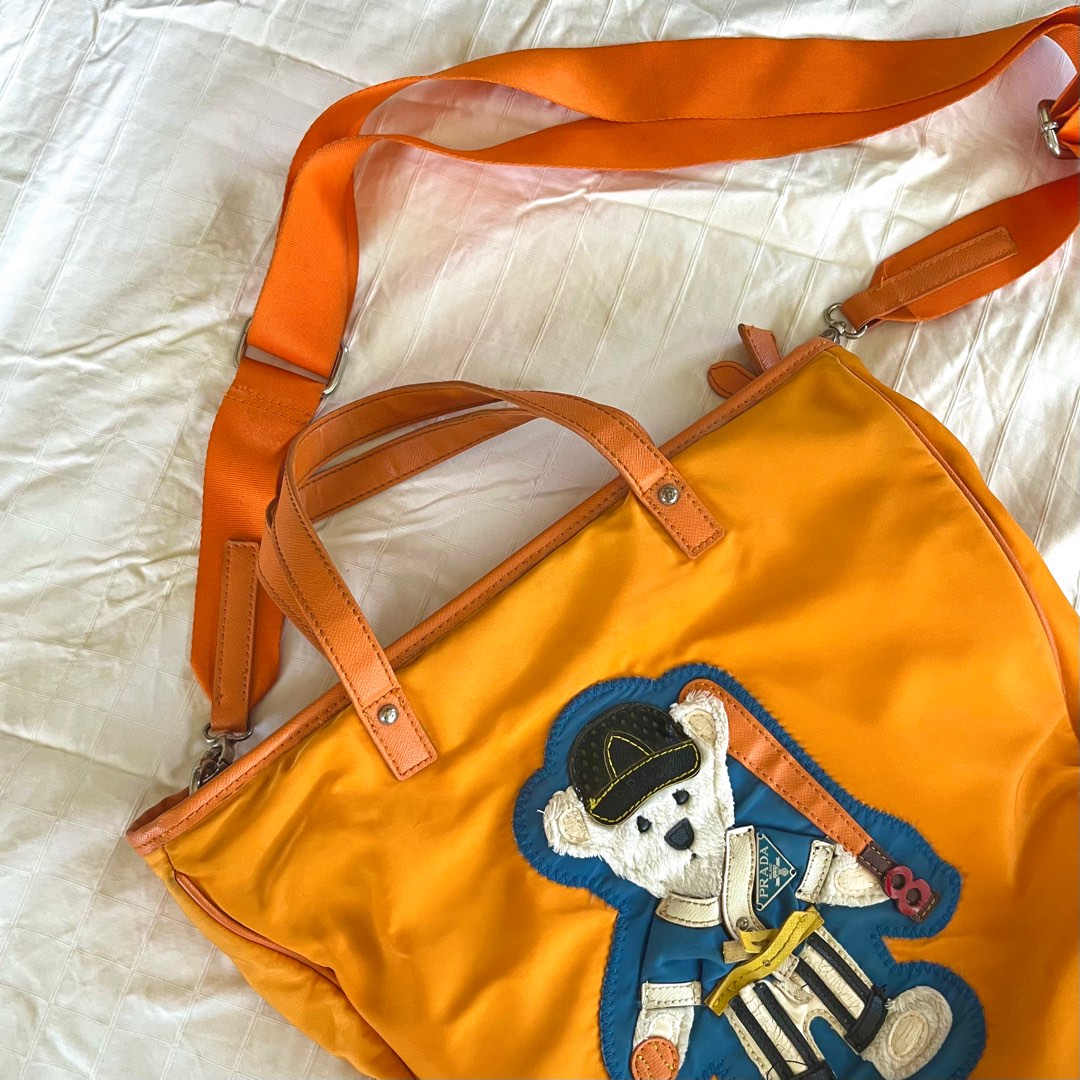 prada teddy bear orange bag, Women's Fashion, Bags & Wallets, Tote Bags ...