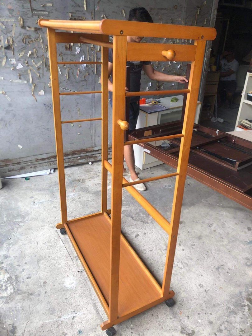 Wooden mobile hanger rack 44L x 20W x 63H inches In good condition ...