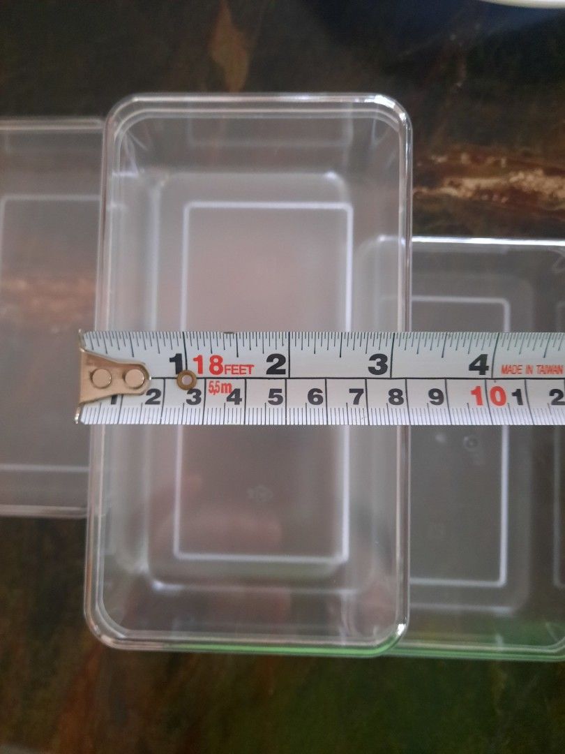 Clear plastic rectangular containers and plastic and metal cylindrical ...