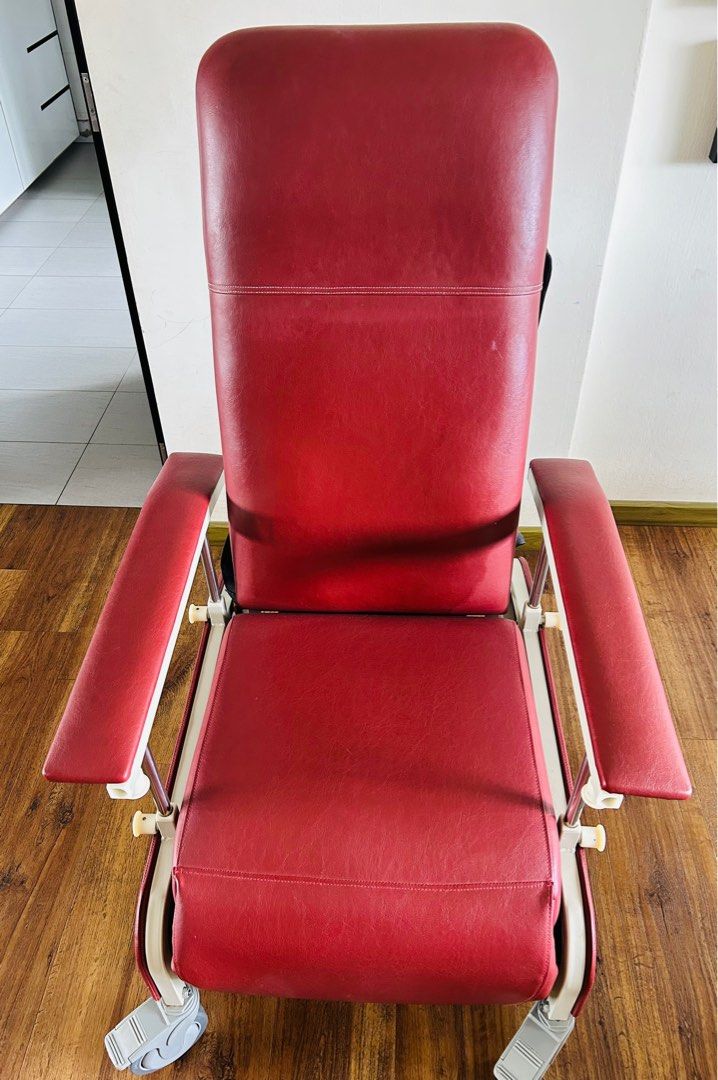 Geriatric reclining chair with tray and moveable wheels, Furniture ...