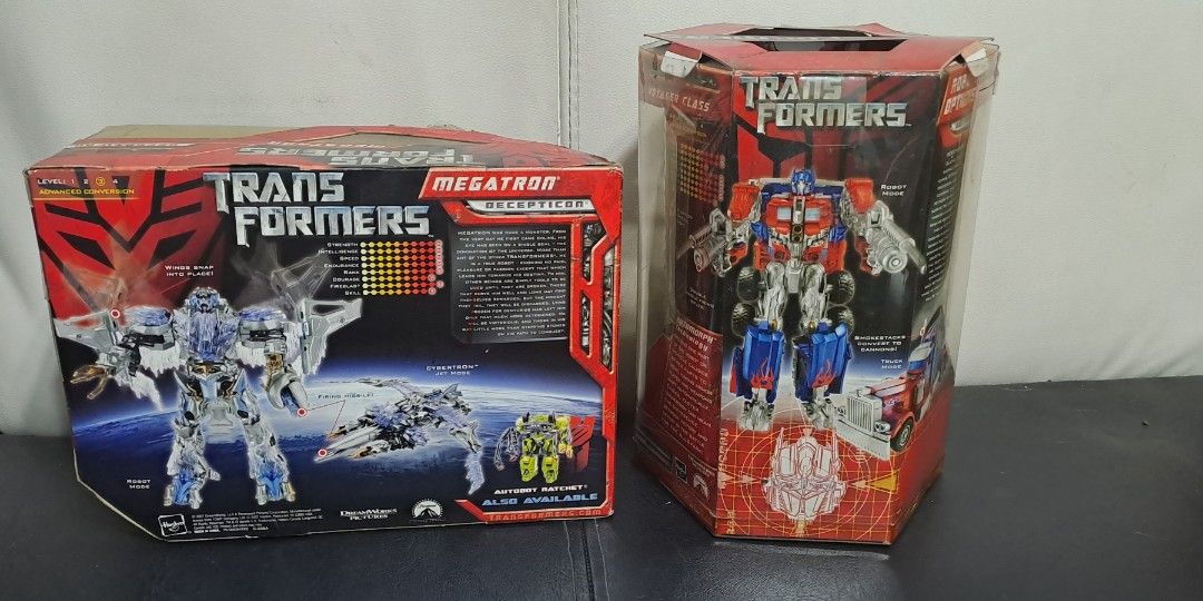 Hasbro Transformers Optimus Prime and voyager class Decepticon Megatron ...