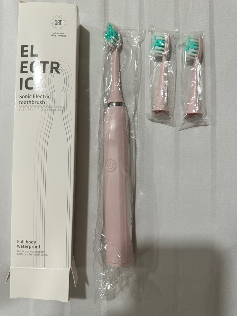 Brand new sonic electric toothbrush with extra new brush head and ...