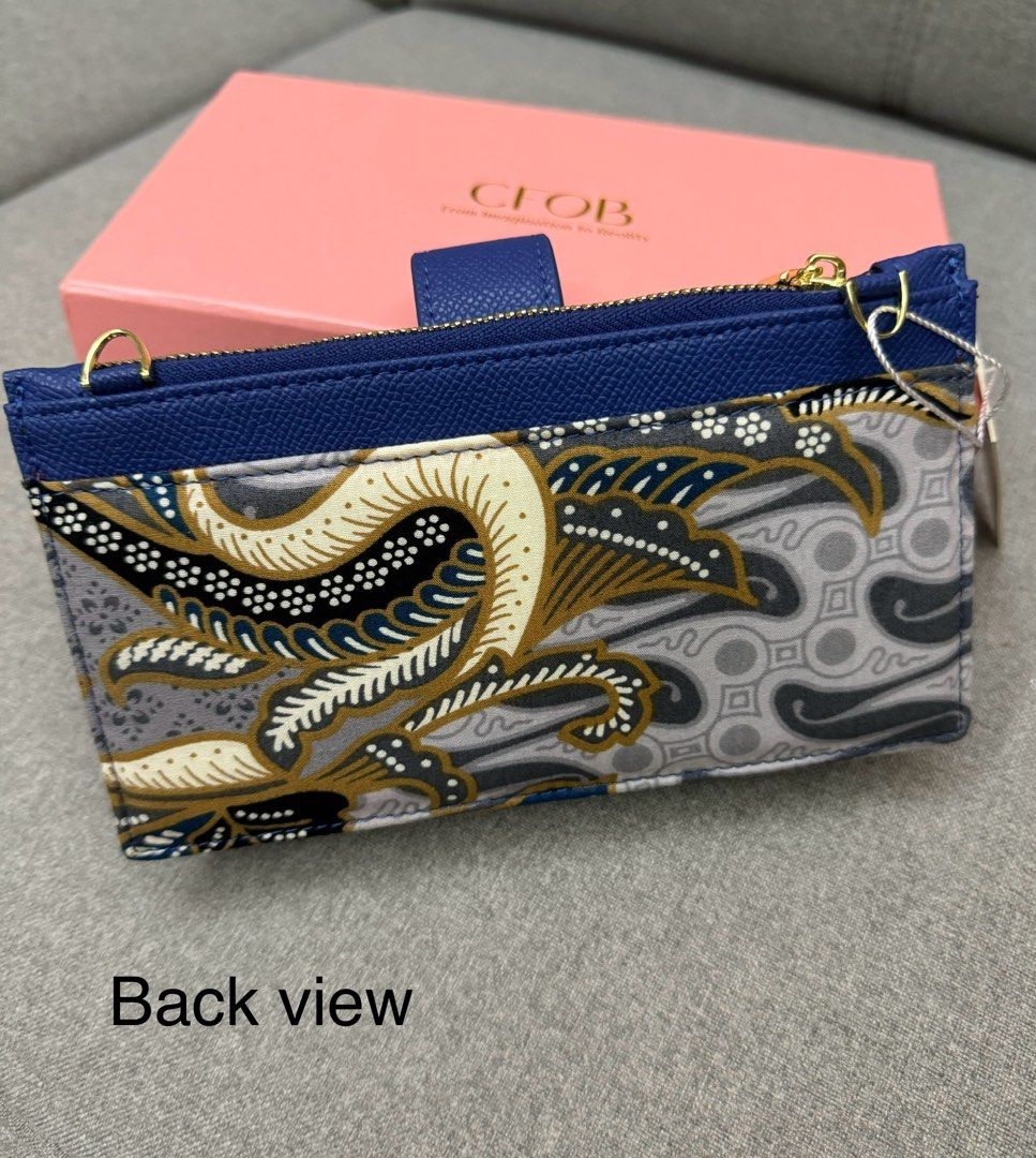 CFOB Calf Wristlet, Women's Fashion, Bags & Wallets, Clutches on Carousell