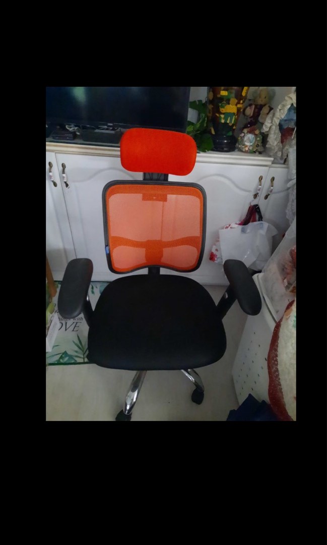 Comfortable Office Chair with arm rest neck rest and orange backing ...