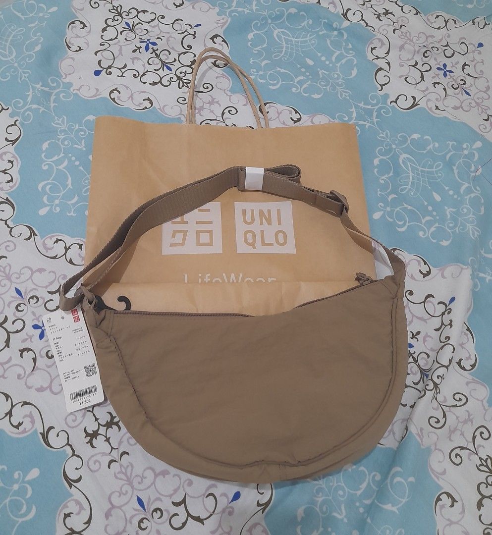 Uniqlo dumpling bag, Women's Fashion, Bags & Wallets, Cross-body Bags on Carousell