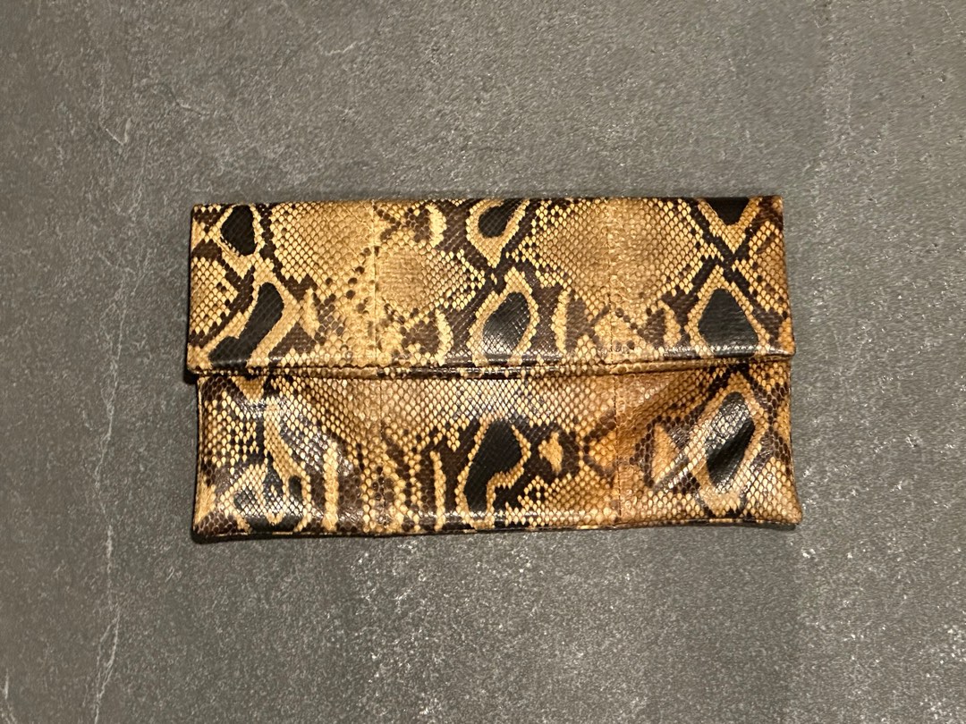 Snake skin clutch, Women's Fashion, Bags & Wallets, Clutches on Carousell