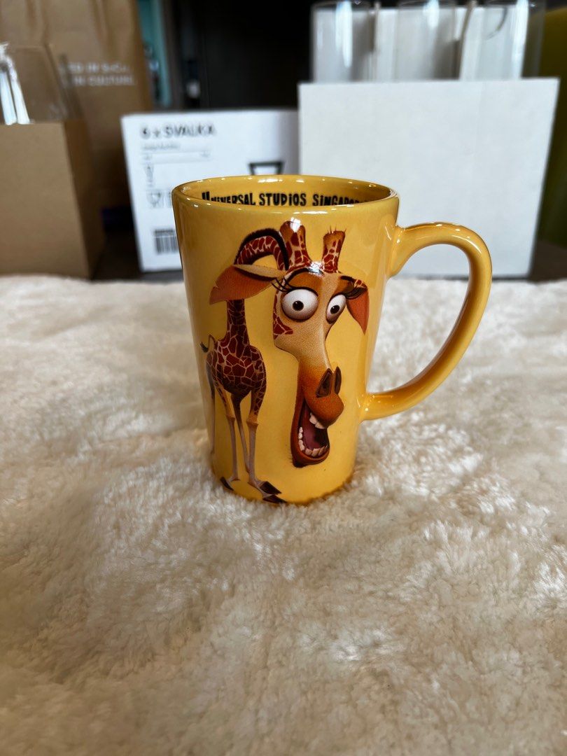 Madagascar Universal studio singapore mug, Furniture & Home Living ...