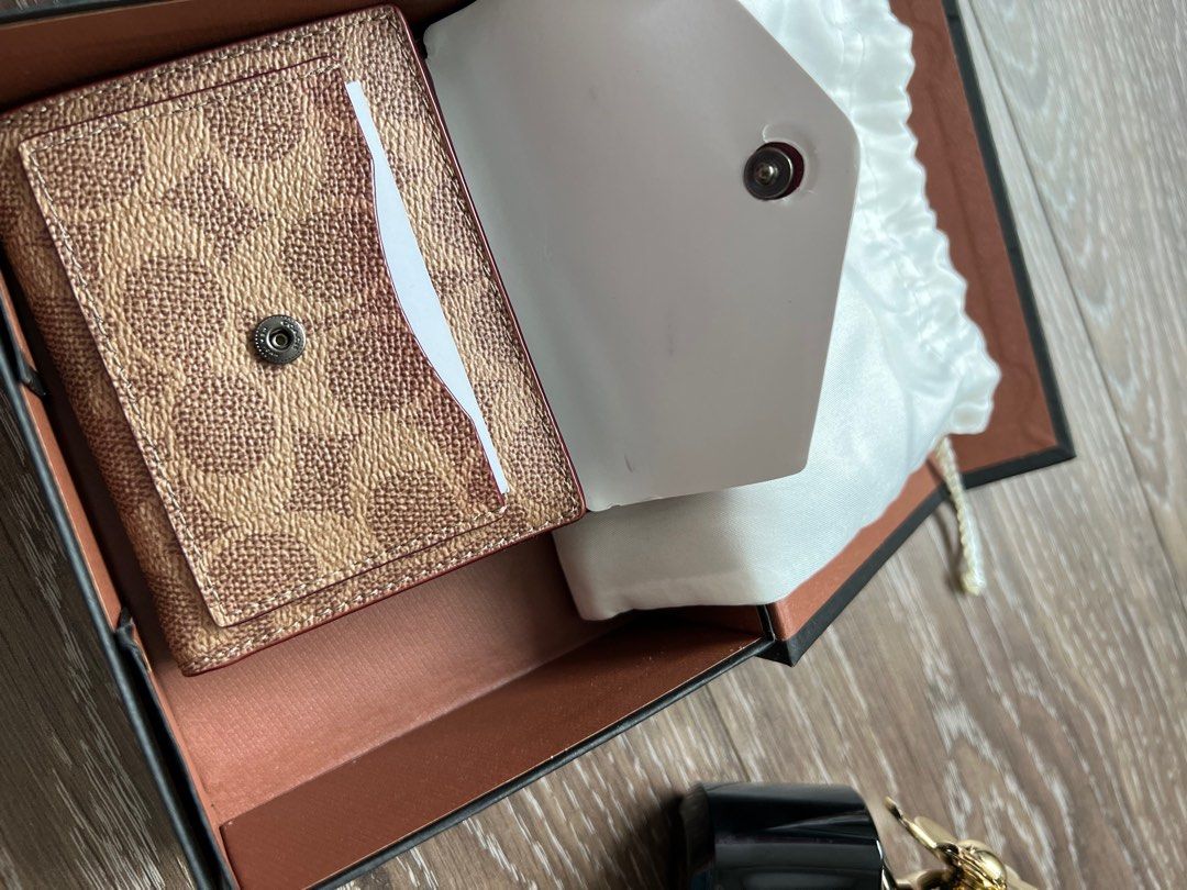Coach blue compact wallet, Luxury, Bags & Wallets on Carousell