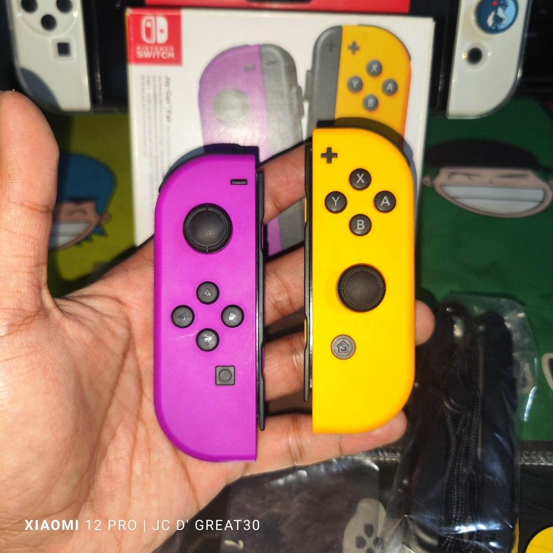 Nintendo Switch joycon purple and orange Original, Video Gaming, Video ...