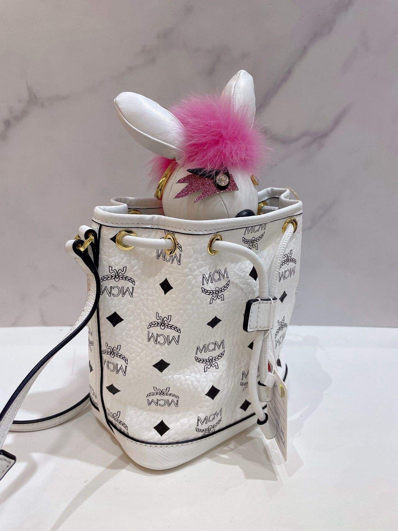 MCM White Rabbit Drawstring Bucket Bag, Luxury, Bags & Wallets on Carousell