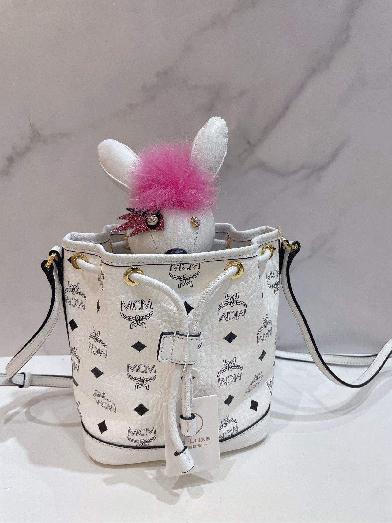 MCM White Rabbit Drawstring Bucket Bag, Luxury, Bags & Wallets on Carousell