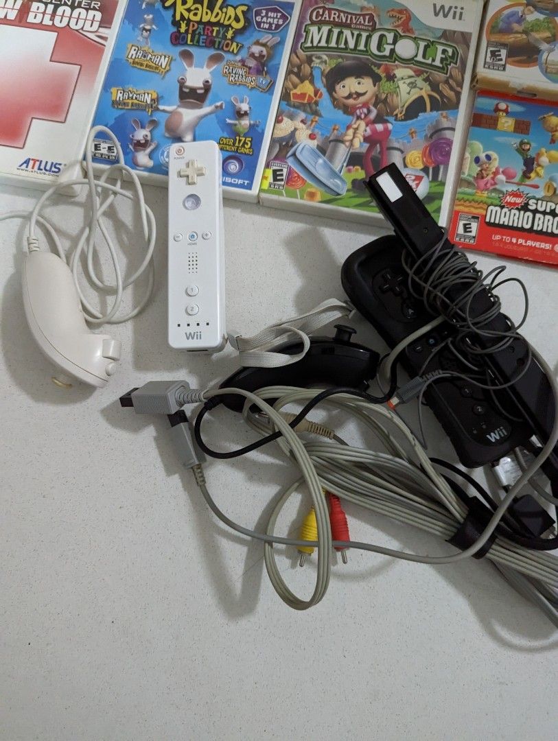 Wii console with 2 set of wiimot and nunchuck and 8 games raving ...