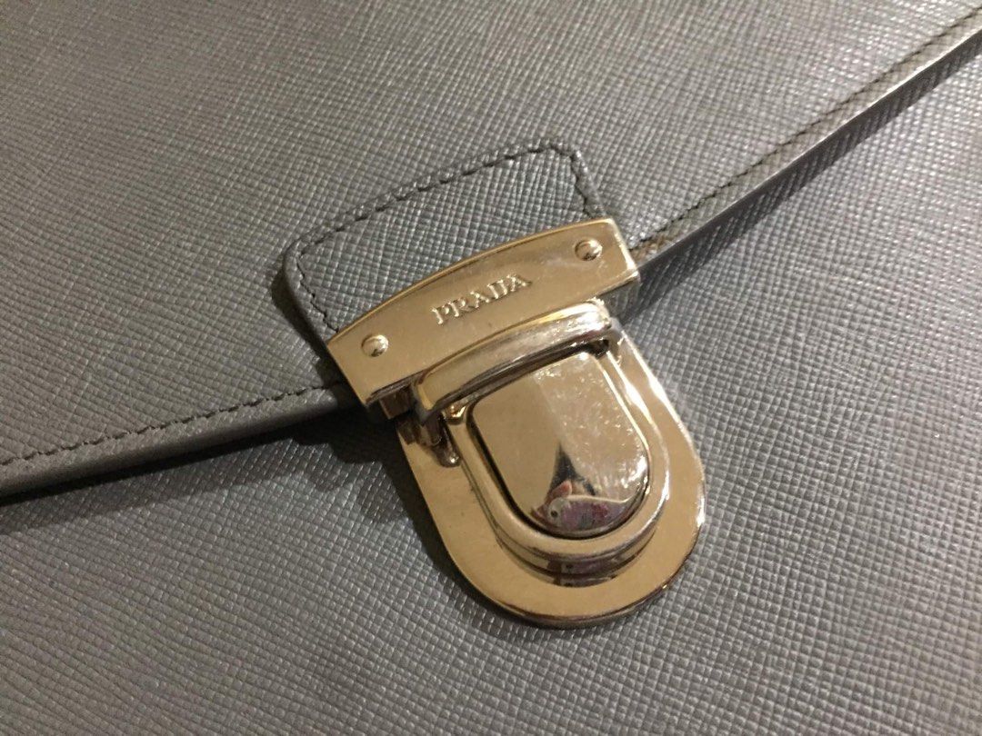 Prada Push Lock Portfolio, Luxury, Bags & Wallets on Carousell