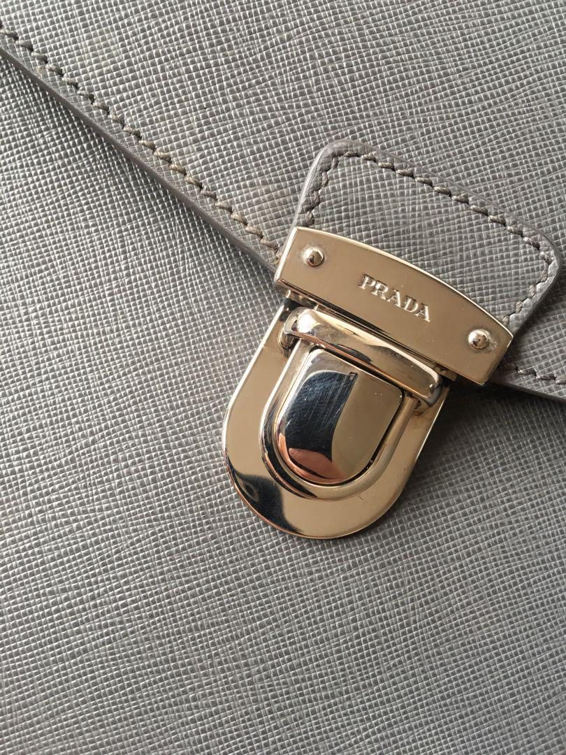 Prada Push Lock Portfolio, Luxury, Bags & Wallets on Carousell