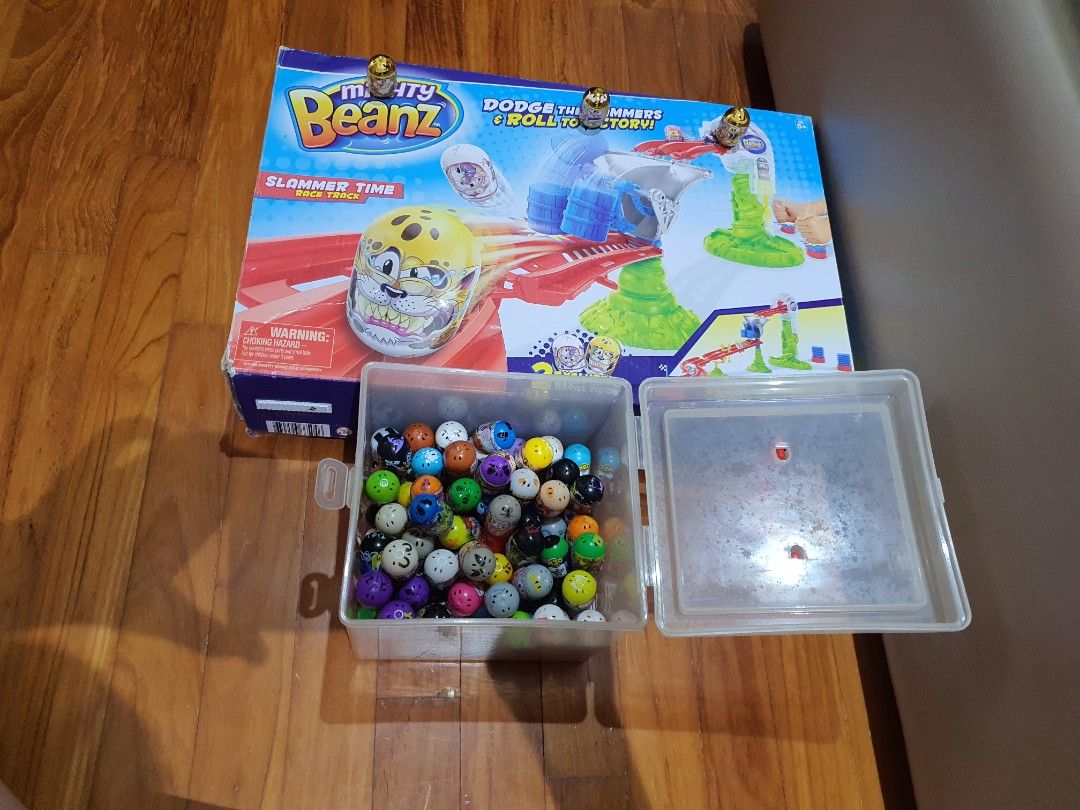 Mighty beanz race track with 3 gold and some other mighty beanz ...