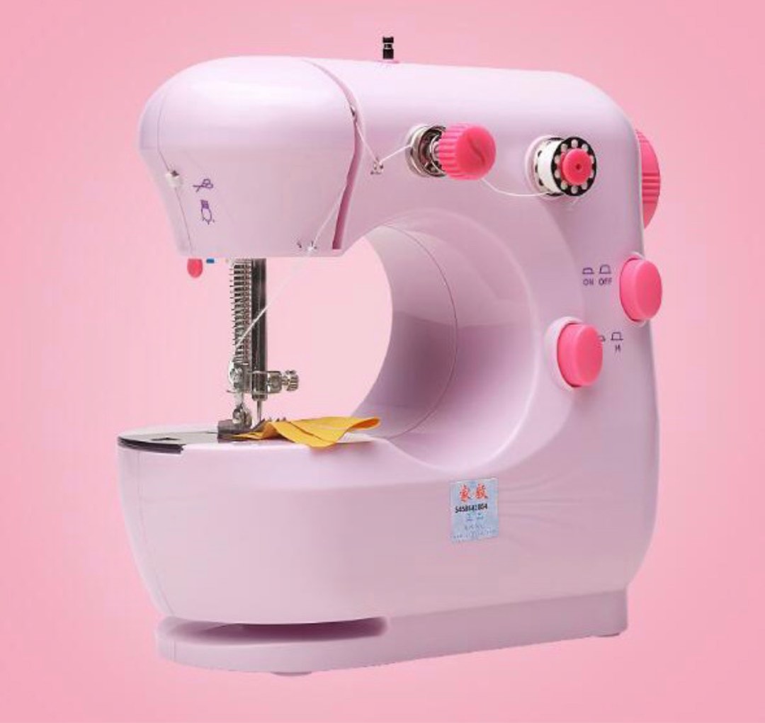 Pink electric mini sewing machine on Carousell