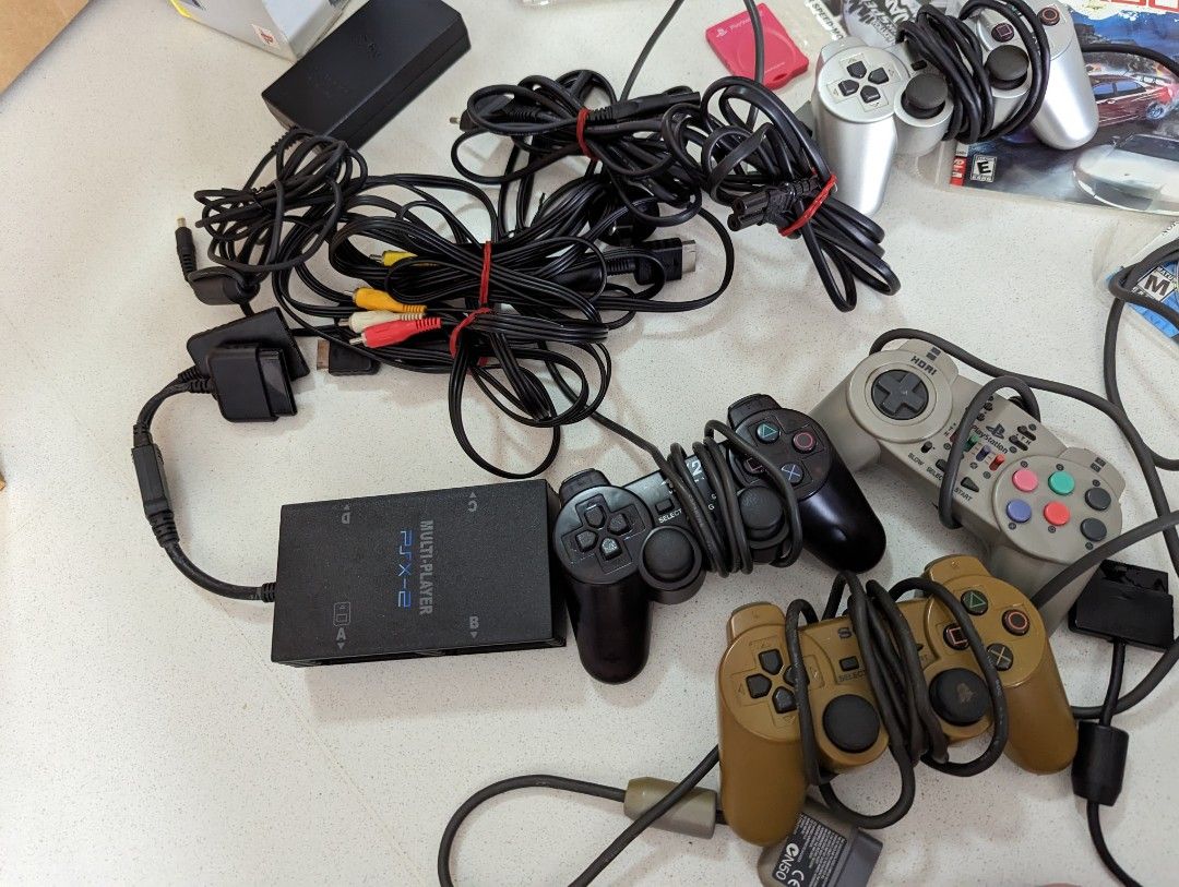 Ps2 slim console modded with 10+ games and few controller. Working ...