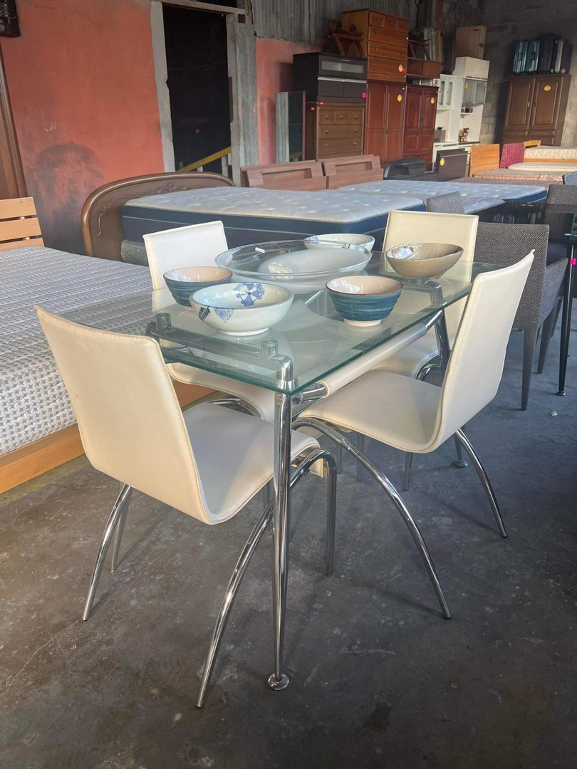 Dining table stainless steel and tempered glass top , leather seats ...