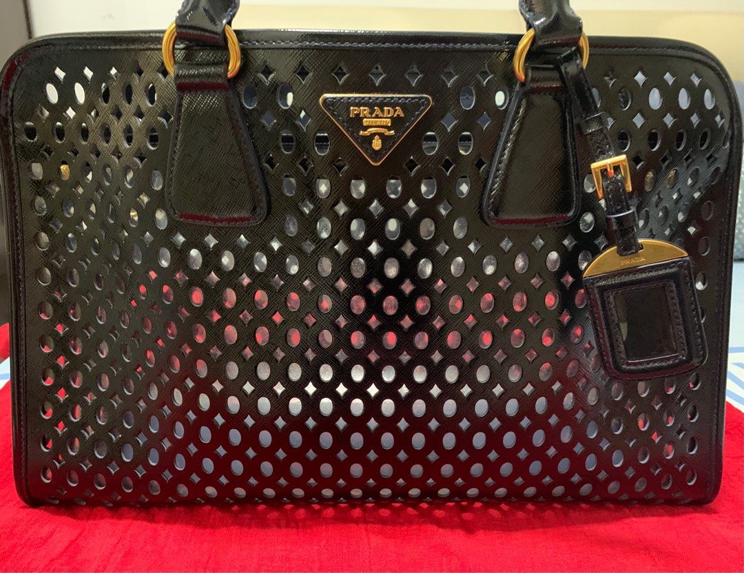 PRADA -100% Authentic cut out Saffiano leather hand carry, Luxury, Bags & Wallets on Carousell