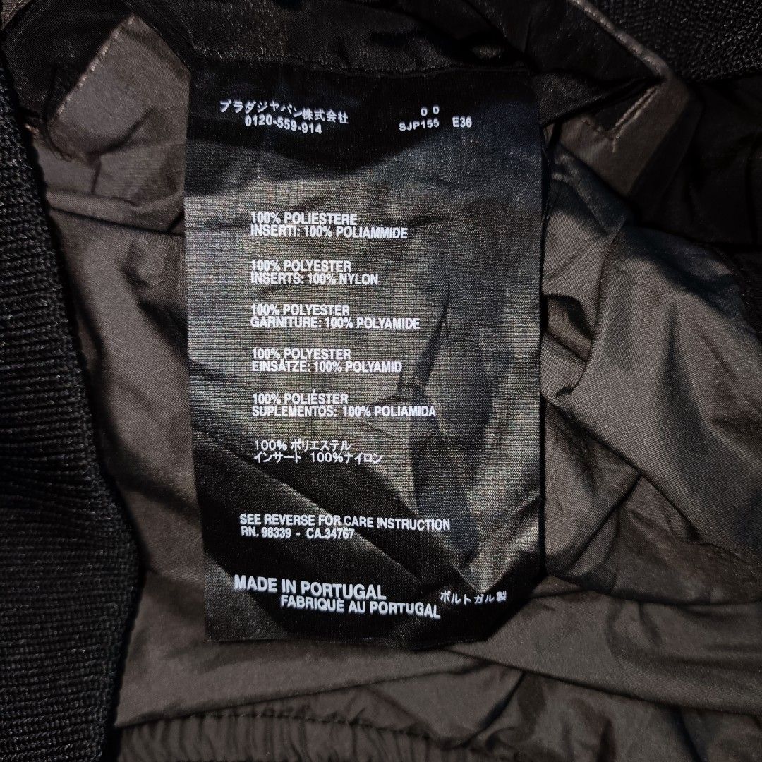 PRADA Metal Logo Jacket, Men's Fashion, Coats, Jackets and Outerwear on ...