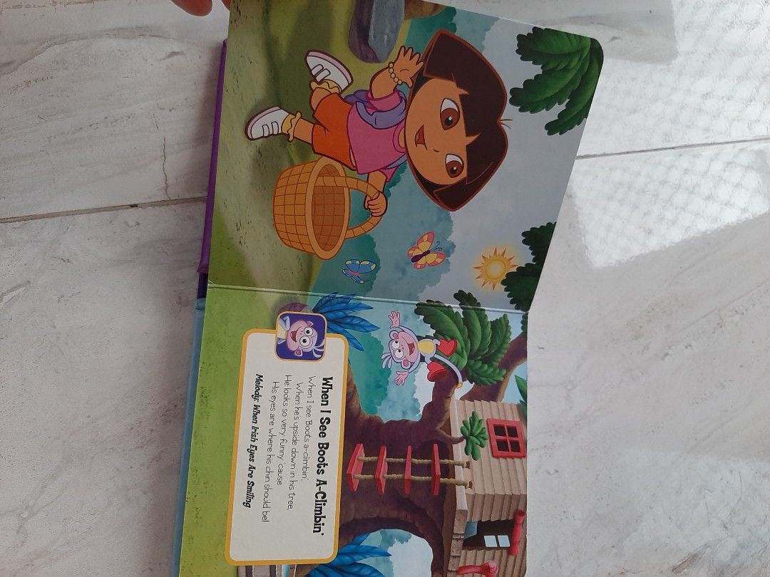 Buku dora let's sing, Buku & Alat Tulis, Buku Anak-Anak di Carousell