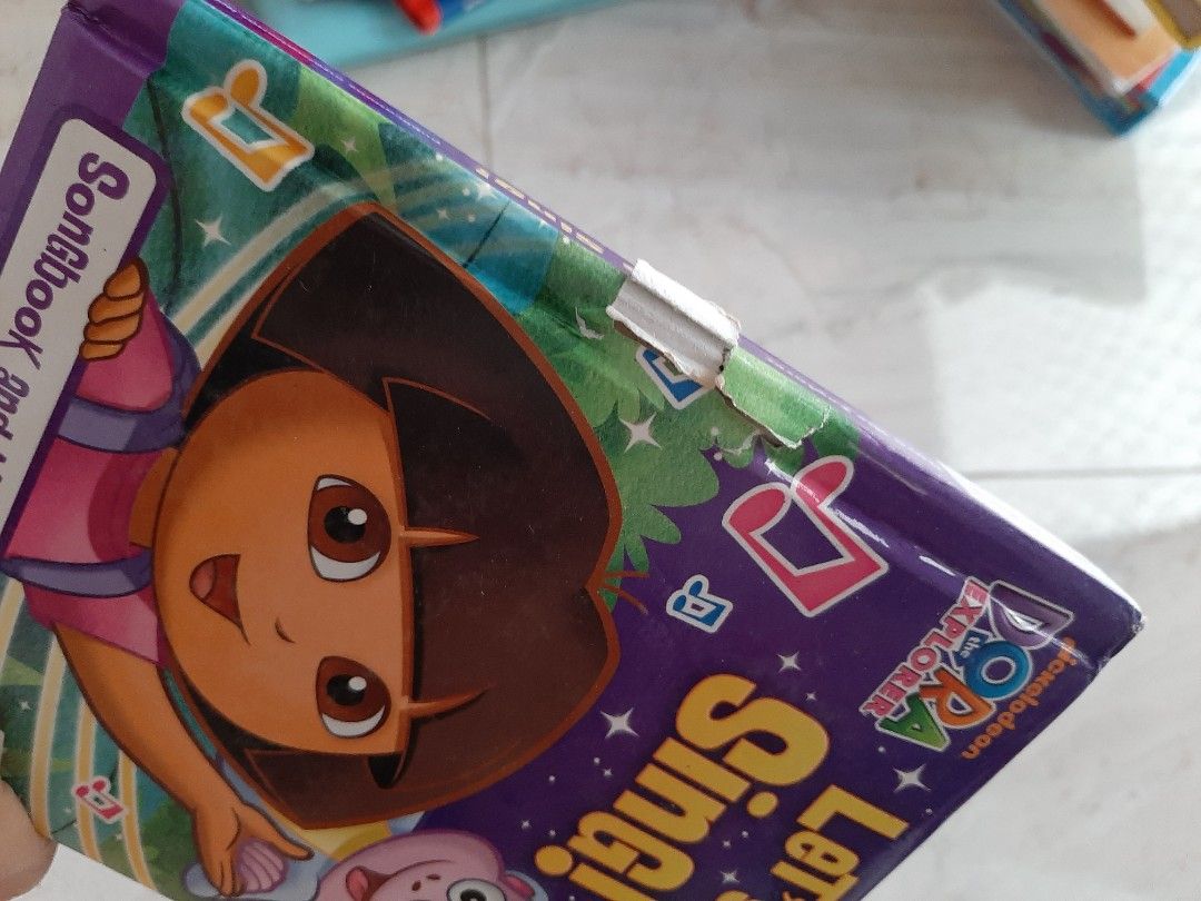 Buku dora let's sing, Buku & Alat Tulis, Buku Anak-Anak di Carousell