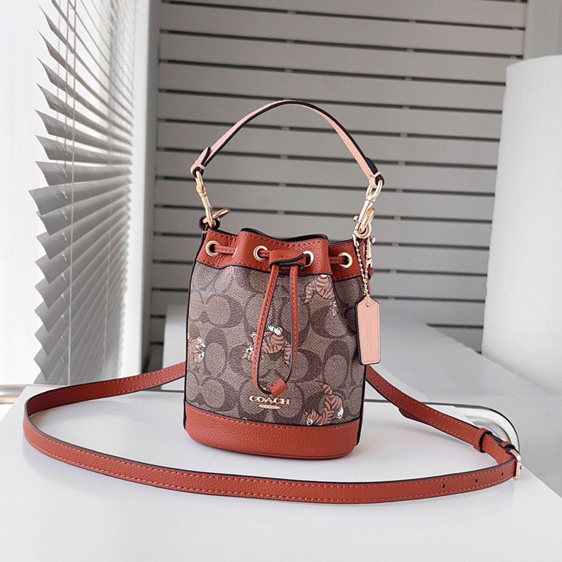 Coach Mini Dempsey Bucket Bag in Signature Canvas with Dancing Kitten ...