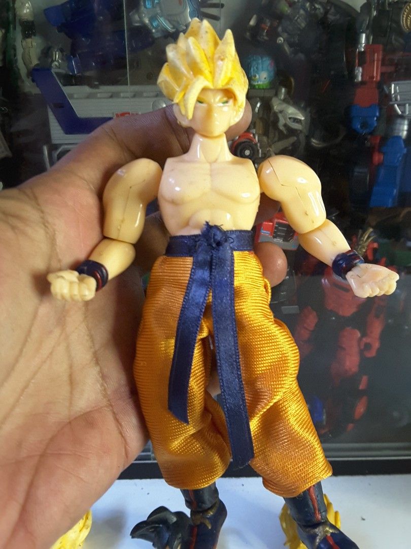 DragonBallZ Goku Bootleg figure with extra head/wig on Carousell
