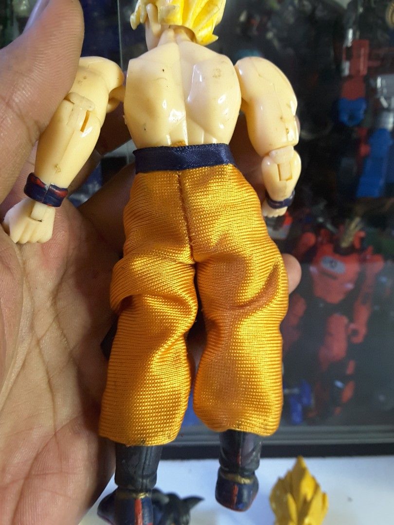 DragonBallZ Goku Bootleg figure with extra head/wig on Carousell