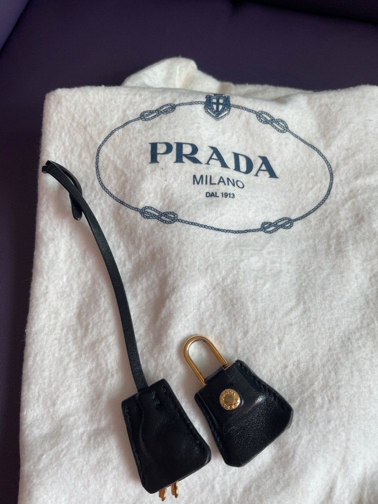 Authentic Prada lock and keys, Women's Fashion, Bags & Wallets, Tote ...