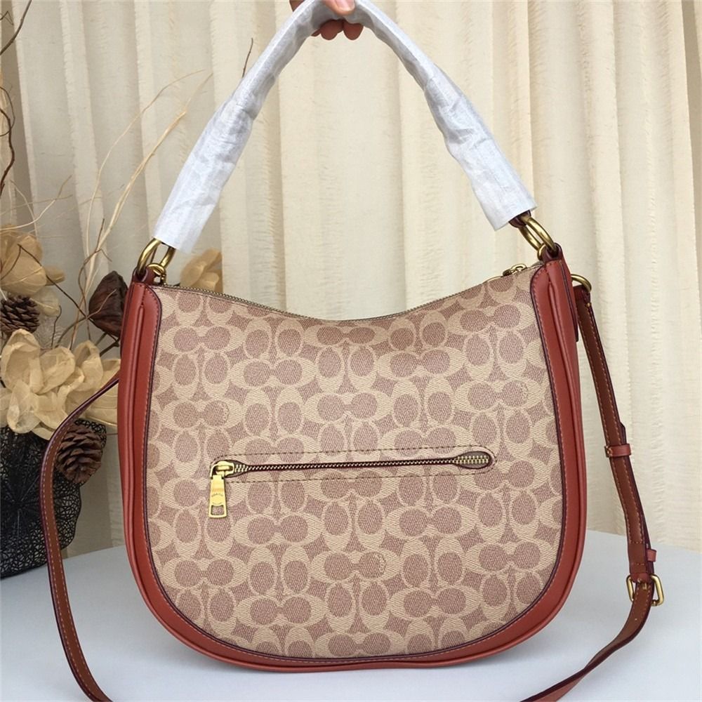 Coach Sutton Hobo In Signature Canvas / Polished Pebble Leather (Women ...