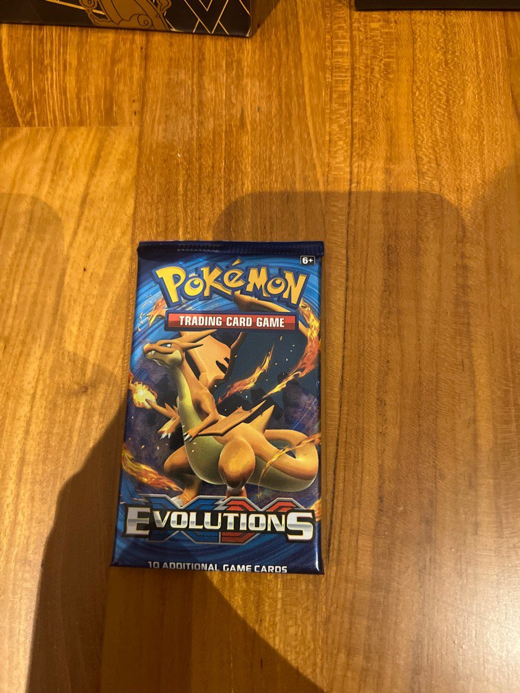 Pokemon XY evolution charizard pack art work, Hobbies & Toys, Toys ...