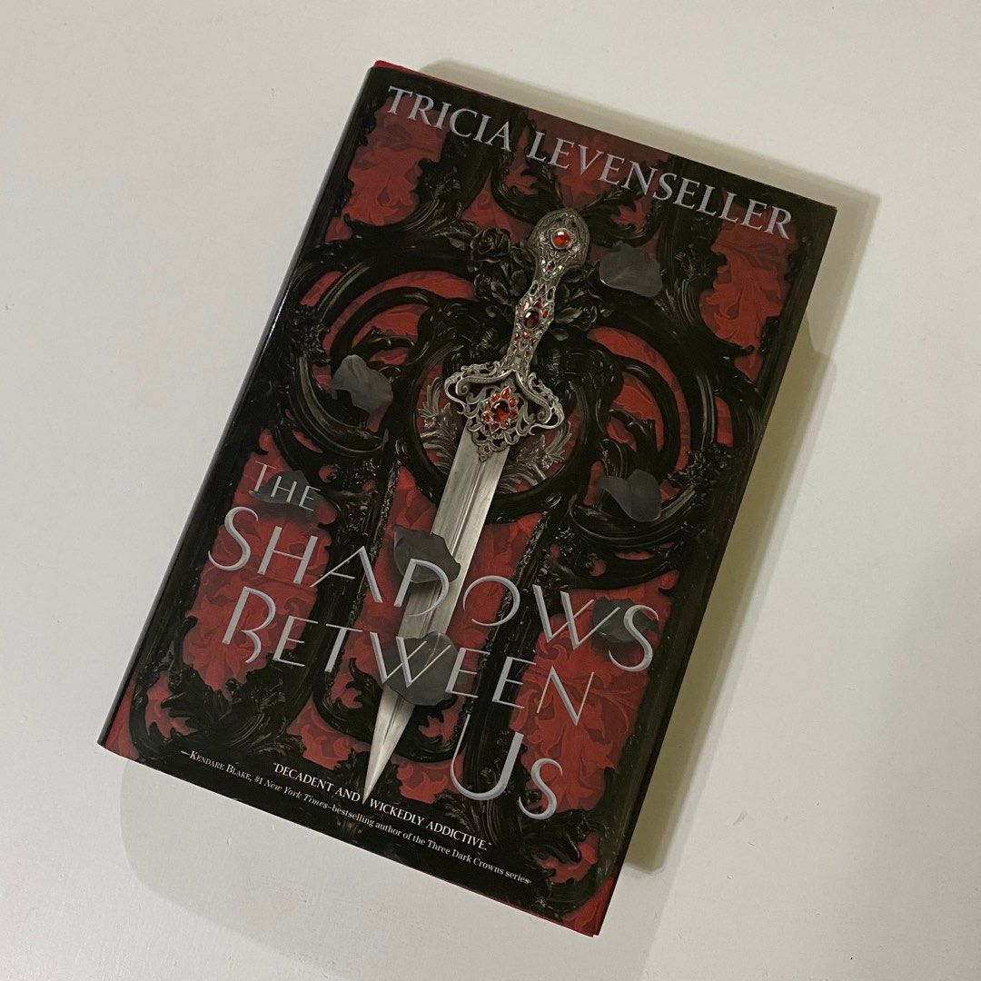 The Shadows Between Us by Tricia Levenseller Hardback, Hobbies & Toys ...