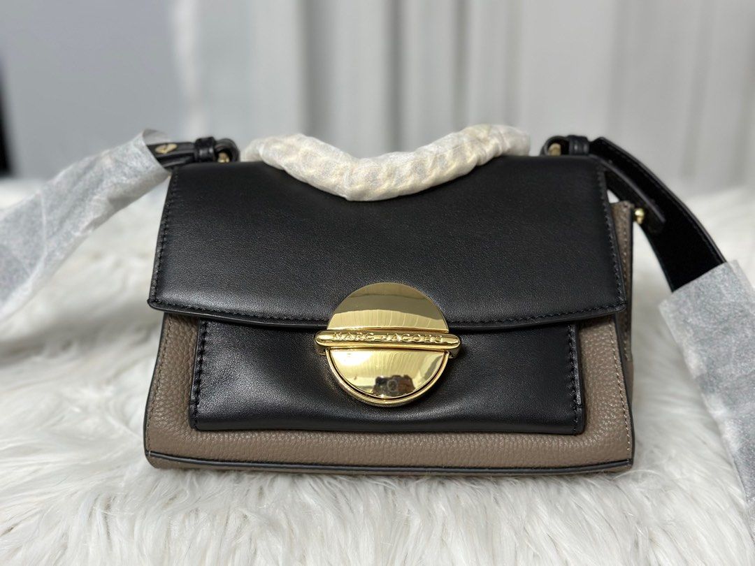 Mj tuck lock crossbody bag on Carousell