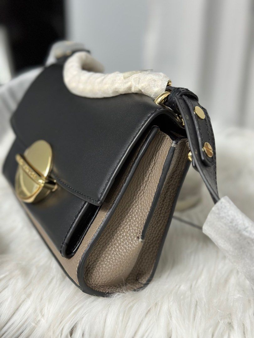 Mj tuck lock crossbody bag on Carousell
