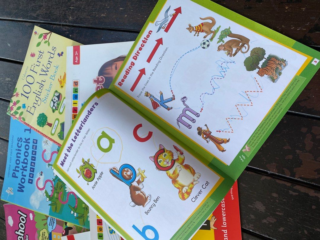Letterland activity books, usborne sticker book and MOE math weekly ...