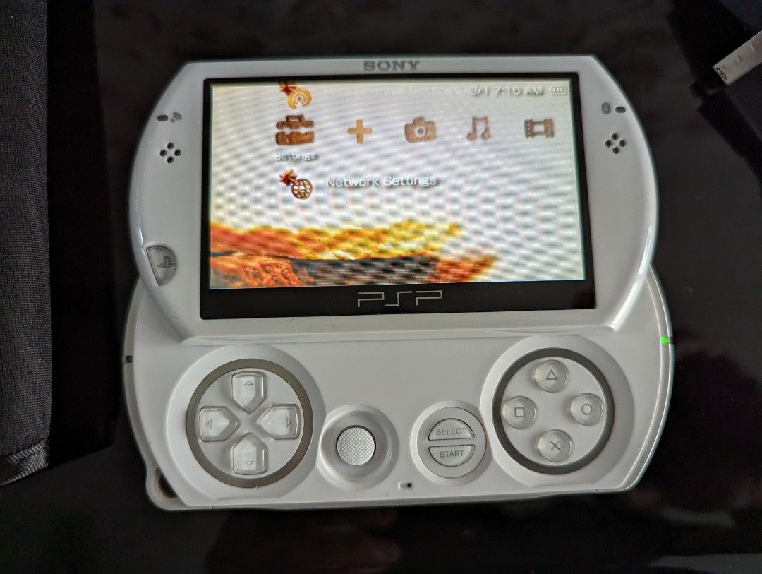 PSP go playstation go console white working and nice with charger, Video Gaming, Video Game ...