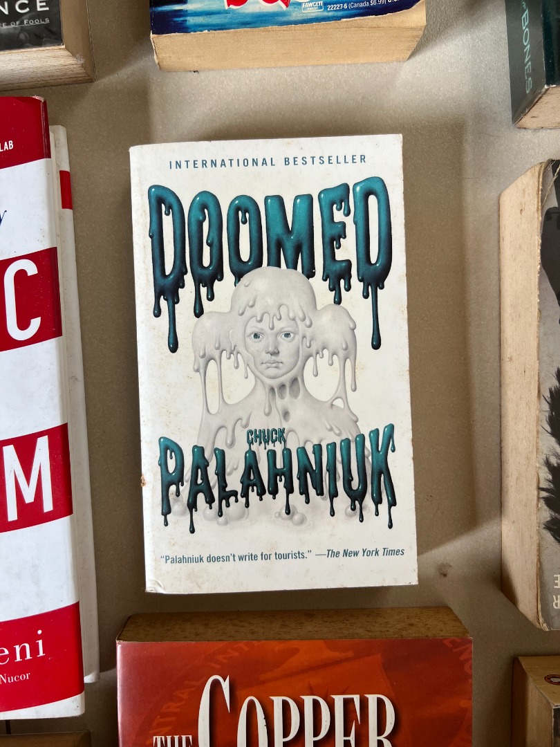 Doomed by Chuck Palahniuk, Hobbies & Toys, Books & Magazines, Fiction & Non-Fiction on Carousell