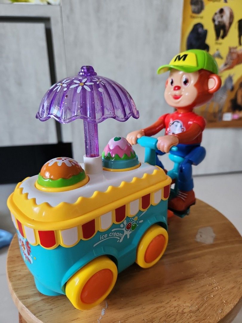 Self Pedaling Monkey Pushing Ice Cream Cart With Music, Hobbies & Toys ...