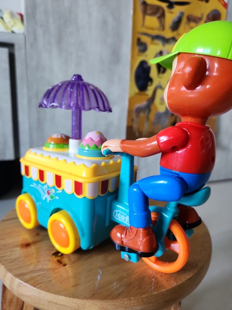 Self Pedaling Monkey Pushing Ice Cream Cart With Music, Hobbies & Toys ...