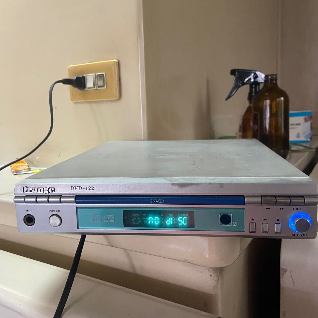 Orange DVD player with cd freebies in working condition on Carousell