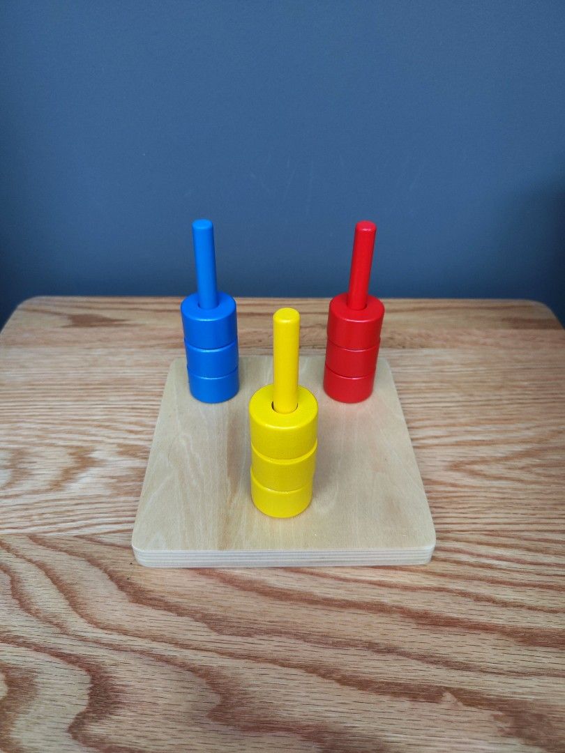 Three pegs with small rings in primary colors |Color sorting Montessori ...