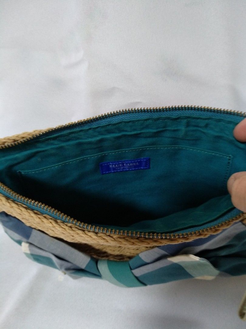 Blue label ribbon straw pouch, Luxury, Bags & Wallets on Carousell