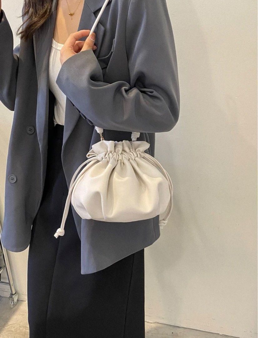 mini drawstring bucket bag in beige, Women's Fashion, Bags & Wallets ...