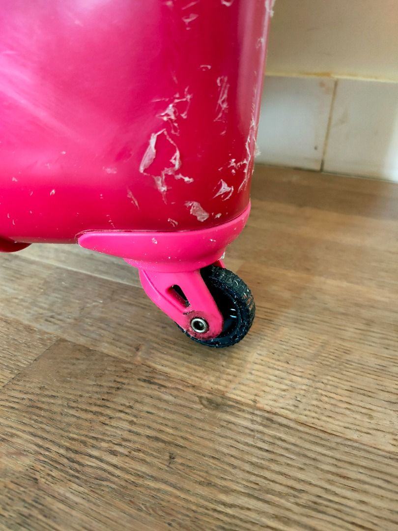 Used red mickey hand carry small luggage, old not new, 4 wheel and ...