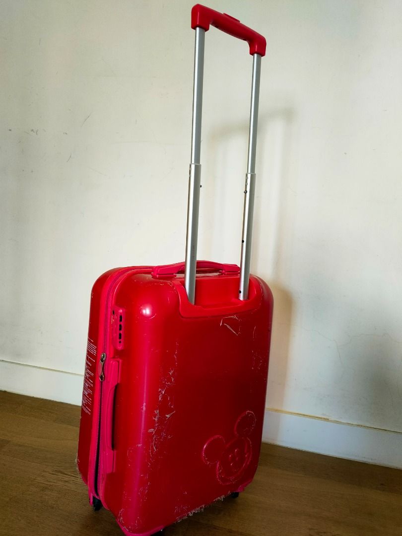 Used red mickey hand carry small luggage, old not new, 4 wheel and ...