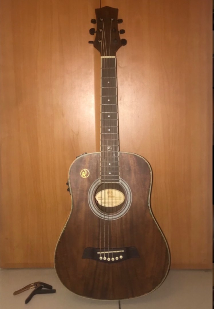 RJ mini acoustic / electric guitar for sale, with match capo, battery ...