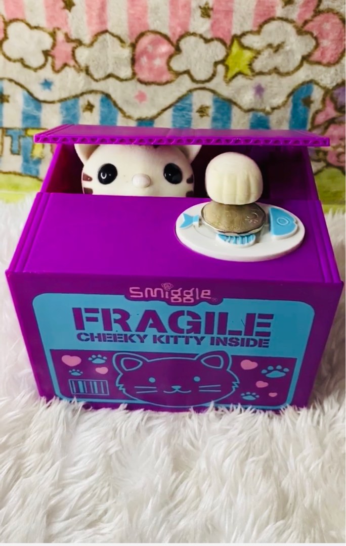 Smiggle Cat Coin catcher coin bank 250 on Carousell